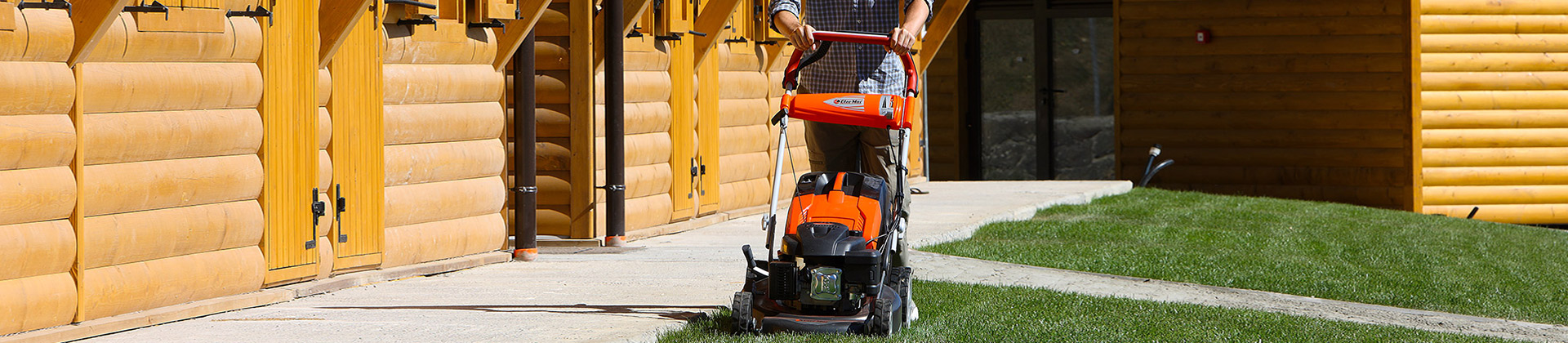 Cutting the garden lawn - Oleo-Mac